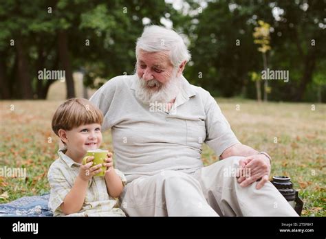 Grandfather Grandson Drinking Tea Fishing Hi Res Stock Photography And Images Alamy