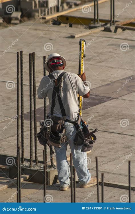 Construction Worker Measuring Rebar At A Construction Site Stock Image Image Of Hard
