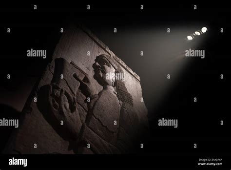 Ancient Assyrian Stone Relief Illuminated In Dramatic Lighting Iraq