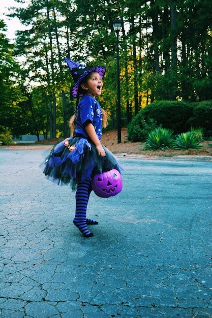 Premium Photo Full Length Of Girl In Costume Standing On Cobbled Footpath