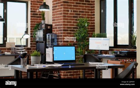 Empty Business Office With Greenscreen On Laptop Computer Desk With Isolated Copyspace Template