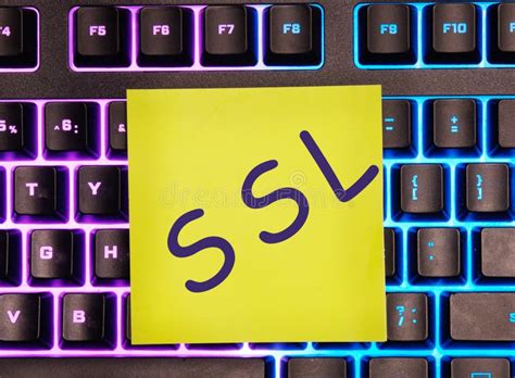 Ssl Security Certificate Written On A Yellow Sticker On A Laptop Keyboard With Backlight Stock