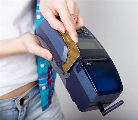 Girl Holding A POS Terminal Customer Is Paying By Credit Card Electronic Money And Credit Card