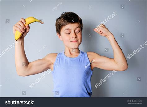 Young Boy Flexing His Biceps Muscles 스톡 사진 603585815 Shutterstock