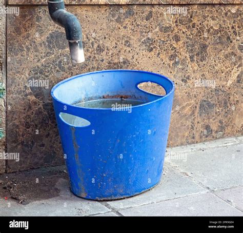 pipe redirecting water from air conditioner into basket to prevent