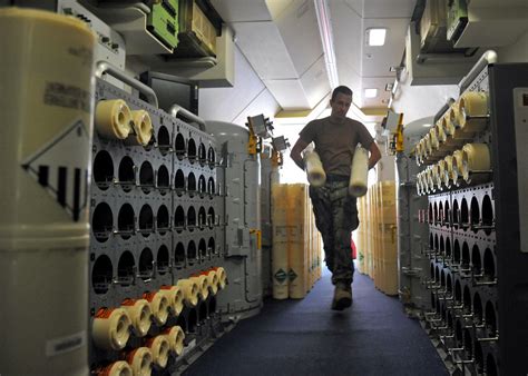 Sailor Carries Sonobuoys Onto A P 8a Poseidon Joint Base Flickr