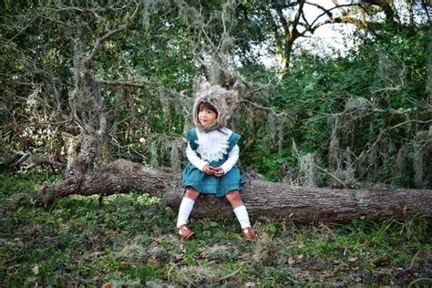 Premium Photo Full Length Portrait Of Girl Sitting On Log Wearing A