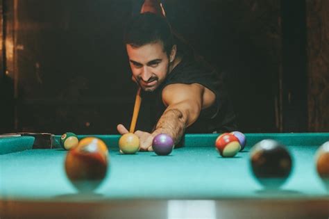 Premium Photo Handsome Boy Playing Pool Game