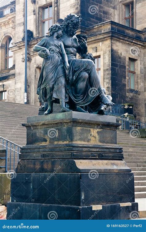 Statue Of A Satyr With A Small Harp On A Tree Royalty Free Stock Image