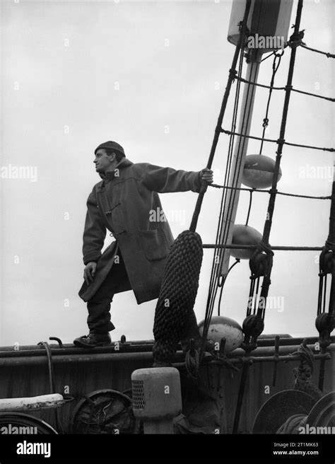 The Royal Navy During The Second World War A Lookout On Board A Minesweeper Stood On The Side