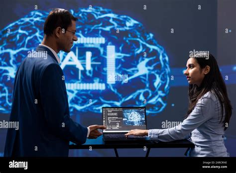 It Staff Members Solving Tasks On Laptop Device Running Artificial Intelligence Programming