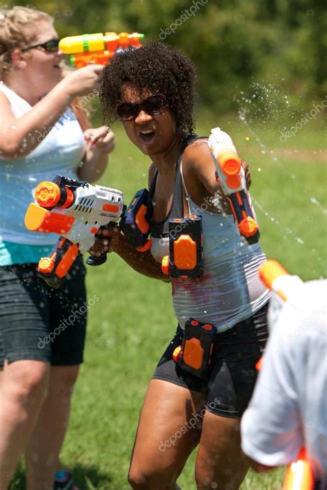 Woman Squirts In Group Water Gun Fight Stock Editorial Photo Bluiz