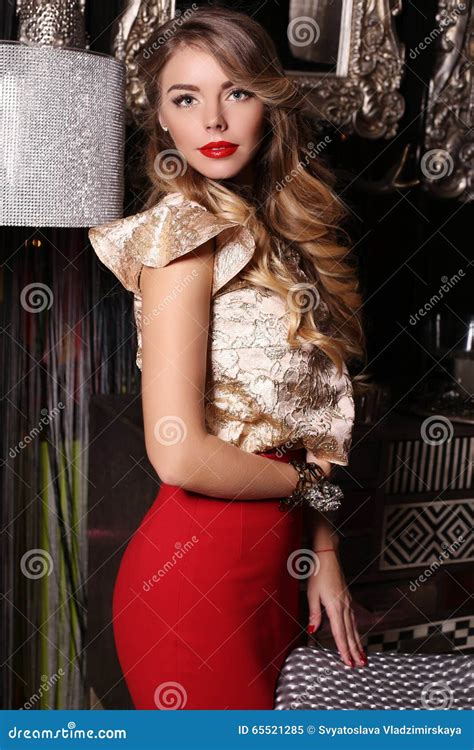 Beautiful Glamour Woman With Blond Hair In Luxurious Dress Stock Image