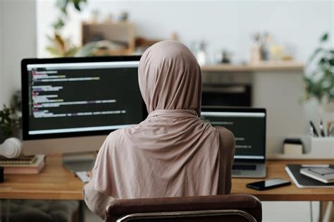 Premium Photo Rear View Of Muslim Female Programmer In Hijab Sitting