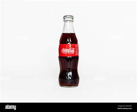 Mexican Coke Bottle With The Sabor Original Flavor The Coca Cola Drink Is In A Small Glass