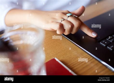 Close Up Photo Of Woman Touching Laptop Fingerprint Sensor With Her Finger To Log In Into System