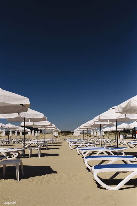 Lined Up Beach Chairs Free Image By