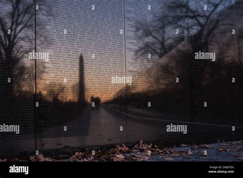 Washington Monument Reflected In Polished Granite Of Vietnam Memorial