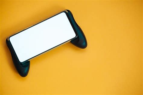 Premium Photo Joystick Mobile Phone Screen Mockup Isolated On Yellow Background Top View