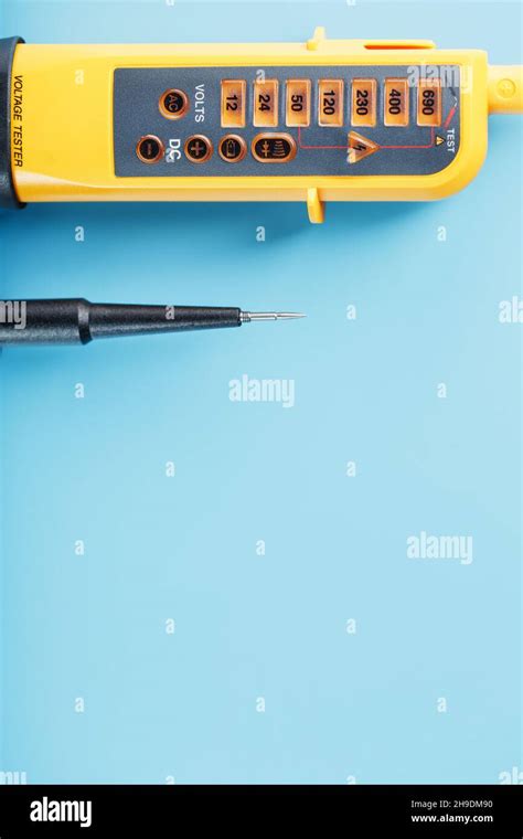 Two Pole Voltage Indicator Close Up On A Blue Background Testing And Verification Of Electrical