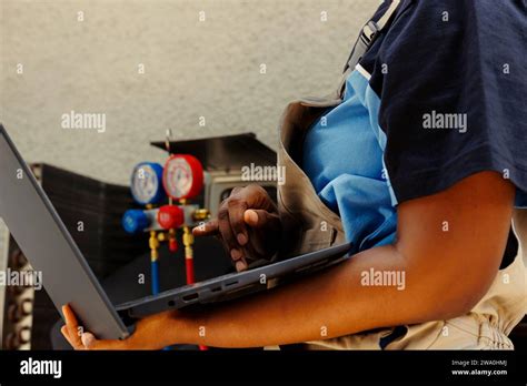 Professional Technician Looking Online For New Blower Fan To Replace