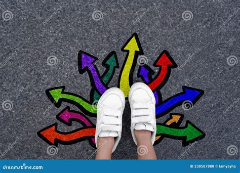 Choice Concept Feet Walking Away And Colorful Graffiti Direction Arrows On Road Background
