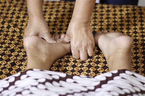Premium Photo Low Section Of Man Relaxing On Bed
