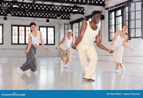 Group Of Young People Learning Modern Dance Movements Stock Image