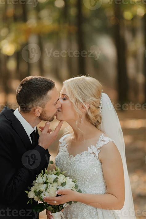 The Bride And Groom Against The Background Of A Fairy Tale Fog In The