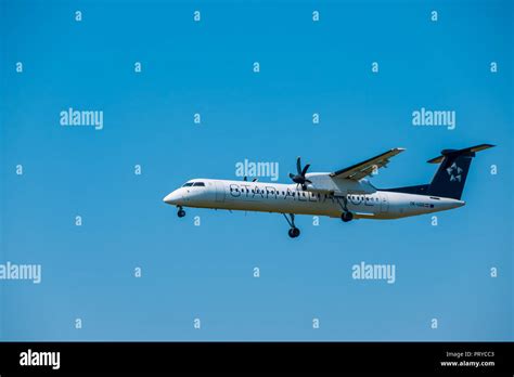 Star Alliance Airlines Bomardier Dash 8 Q400 Airplane Preparing For