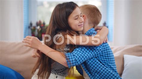 Brother And Sister Hugging