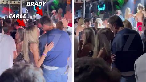 Alix Earle Rubs Tom Bradys Back At Nye Party