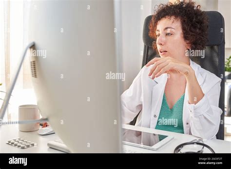 A Female Doctor Uses Her Computer In Her Medical Office Stock Photo Alamy