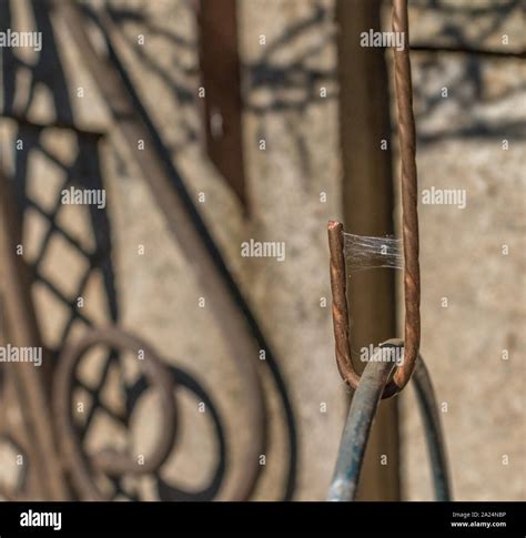Metal Shapes And Shadows With A Small Cobweb Concept Support Image With
