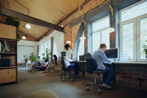 Interactive Co Working Space Bustling Co Working Environment With Young Multiethnic People