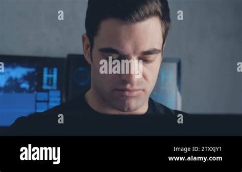 Developer Programmer Working On Computer In A Data Center Filled With