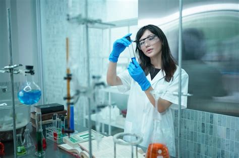 Premium Photo Young Scientist In White Lab Coat Working With Binocular Microscope In The