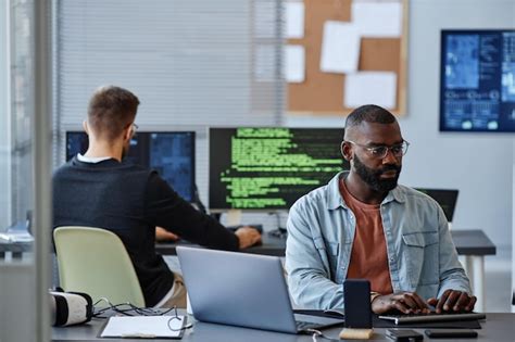 Premium Photo Portrait Of Black Man Using Computer While Programming Software In Office Copy Space