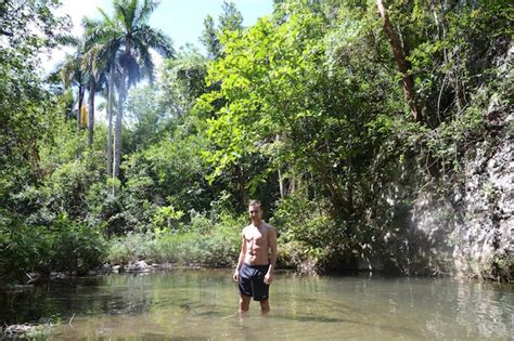 Premium Photo Portrait Of Shirtless Young Man Standing In Lake At Forest