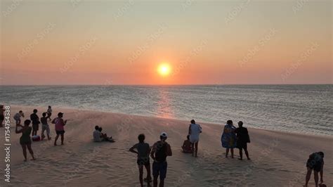 People Watching The Sunset From The Top Of A Dune At Jericoacoara Beach Jijoca De Jericoacoara