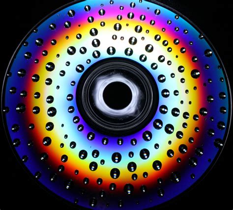 Water Droplets On A Cd Bead Up And Display Refraction Reflection