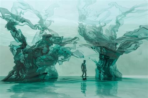 A Man Stands Alone In A Surreal Landscape Of Distorted Topaz Trees Submerged In A Body Of Water