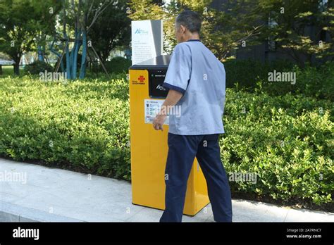 an artificial intelligence ai garbage sorting bin is displayed at