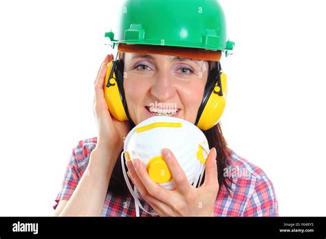 Smiling Female Construction Worker With Protective Mask Wearing Green Helmet And Protective