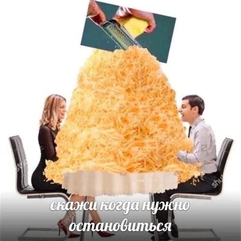 На стоковой фотографии сидят за столом и улыбаются девушка со светлыми волосами в чёрном платье