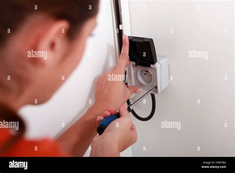 Woman Repairing Electrical Socket Stock Photo Alamy