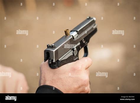Close Up Detail View Of Pistol Handgun Gun Malfunctions Clearance Safety Drills Stock Photo
