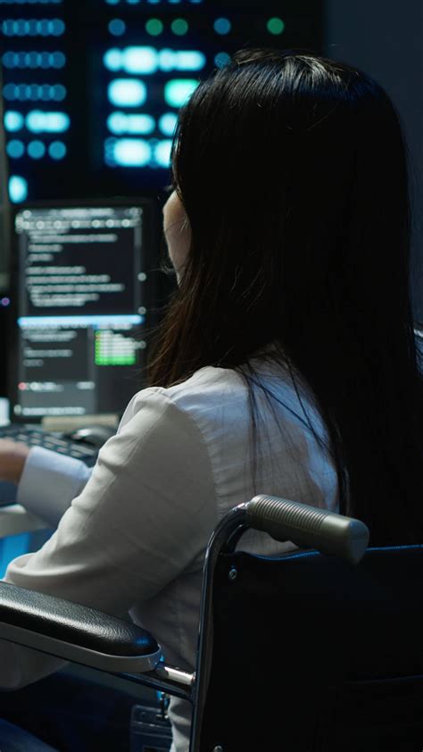 Vertical Person With Paraplegia In Inclusive Server Hub Overseeing Data