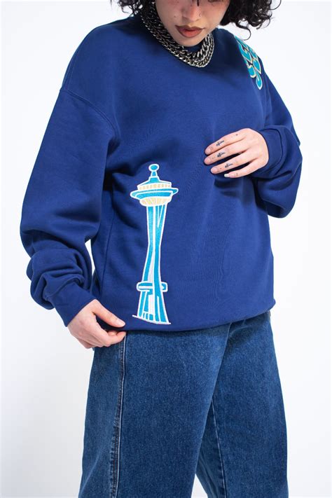 Mediums Collective Ots Seattle Crew Nipsey Blue M E D I U M S