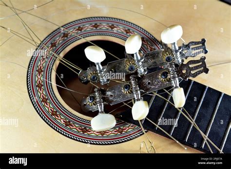 A Broken Wooden Old Classic Guitar With Damaged Strings Chords